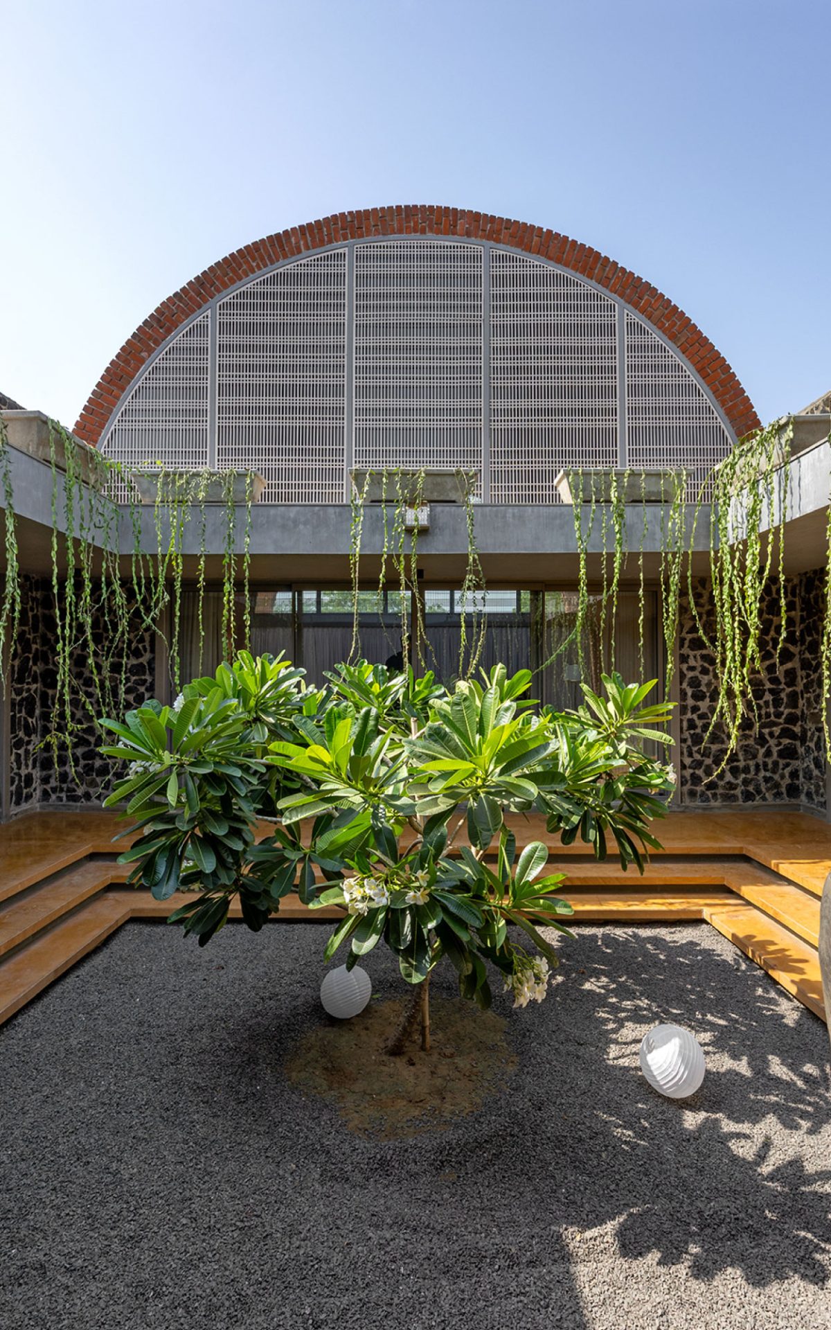 Rammed Earth and Brick Vaults Shape a Grounded Vadodara Retreat